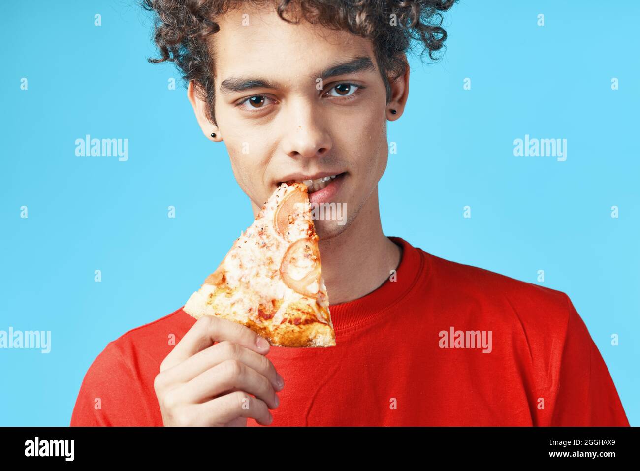 guy with curly hair bird in hands fast food delivery Stock Photo - Alamy