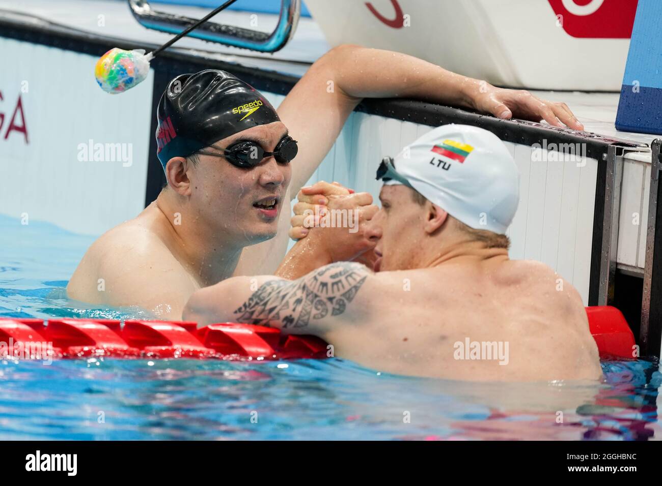 Tokyo, Japan. 1st Sep, 2021. Yang Bozun (L) of China reacts with ...