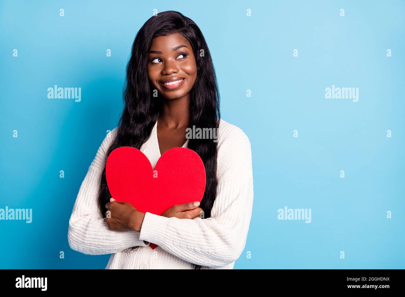 Photo of attractive dreamy afro american woman look empty space hold ...