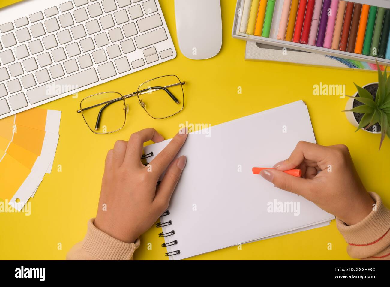 Creative woman drawing picture with on notebook Stock Photo - Alamy