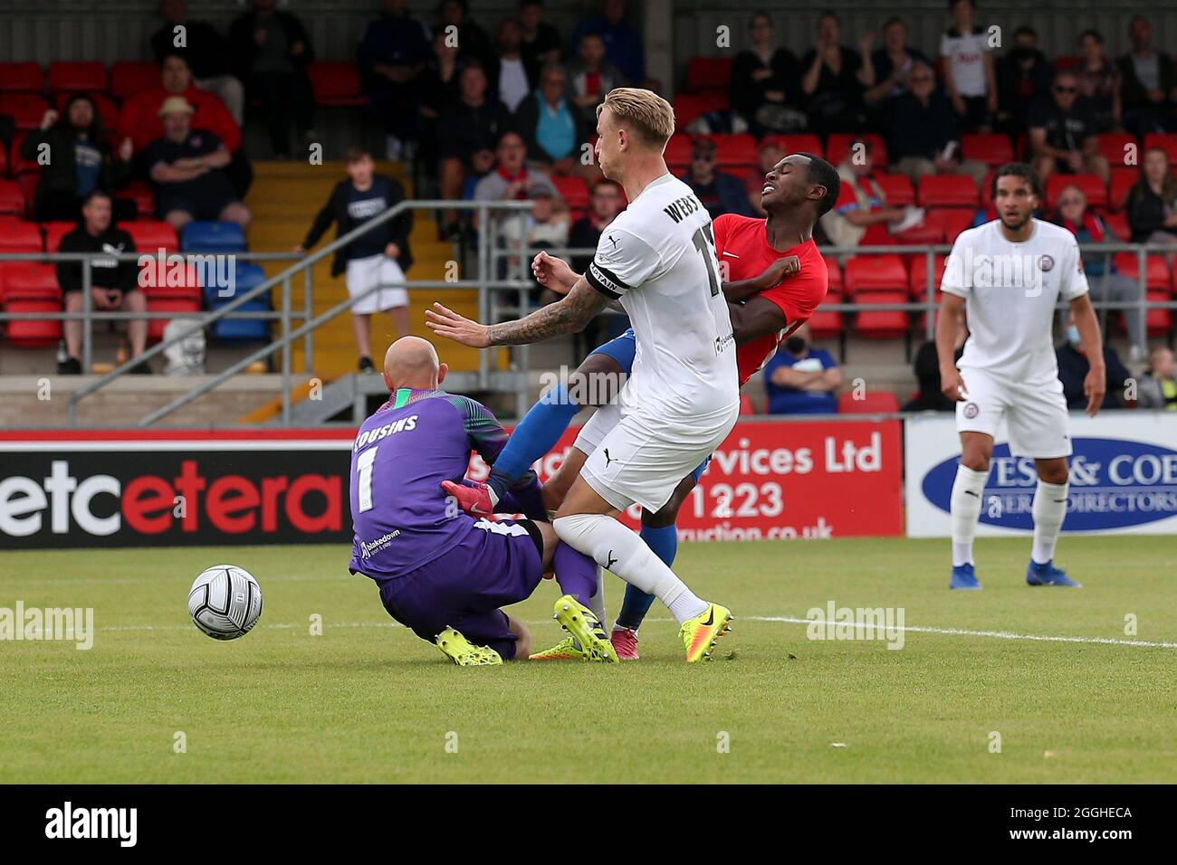 Josh Walker of Dagenham scores the first goal for his team and ...