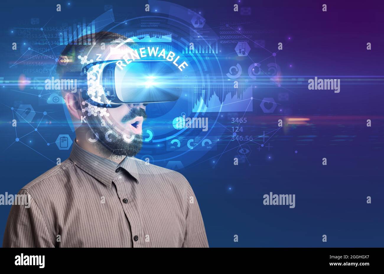 Businessman looking through VR glasses Stock Photo - Alamy