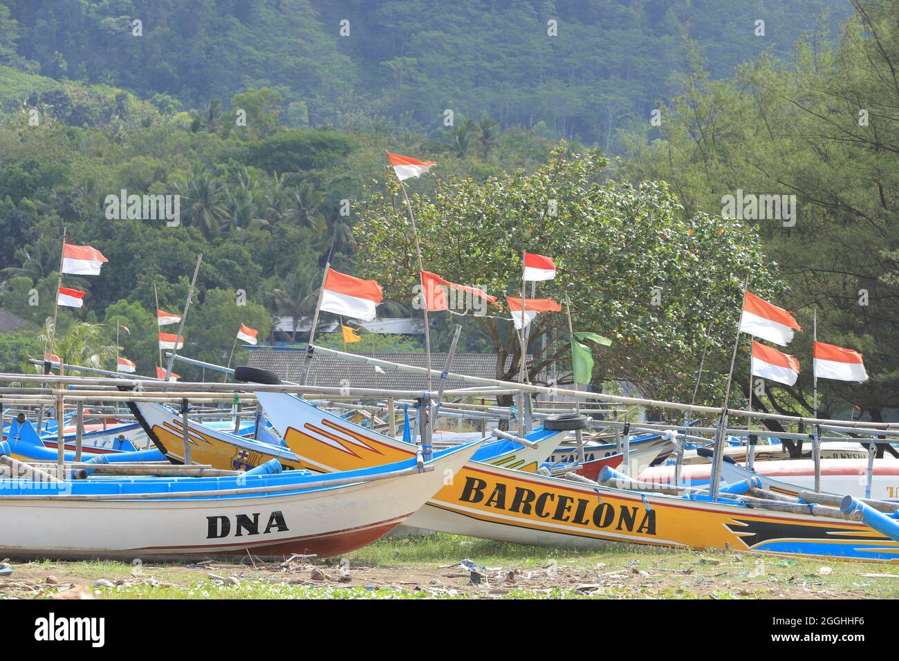 PACITAN, INDONESIA - August 22, 2021: A fishing boat with a red and ...