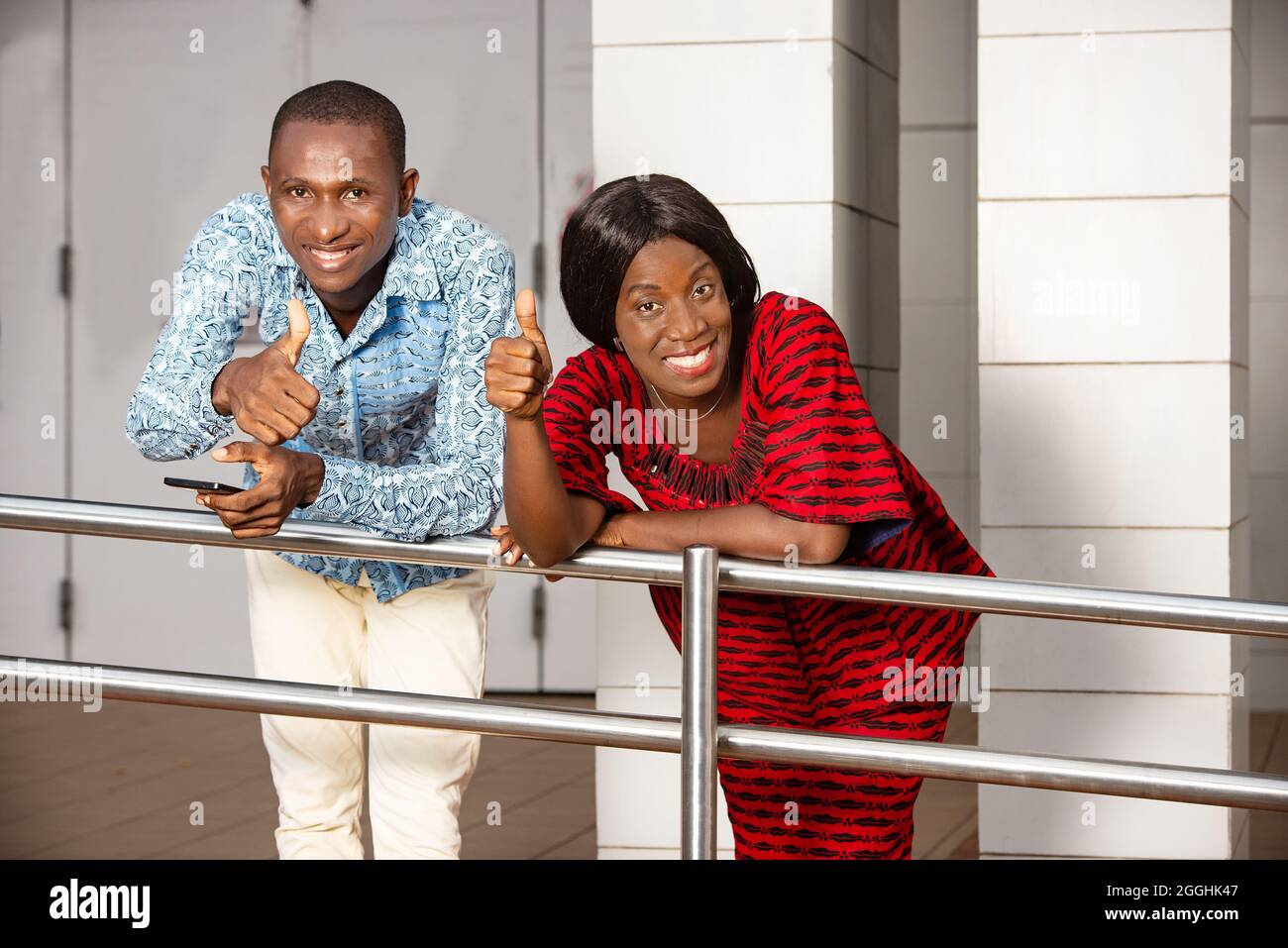 two business people in traditional clothes waving their fingers and ...