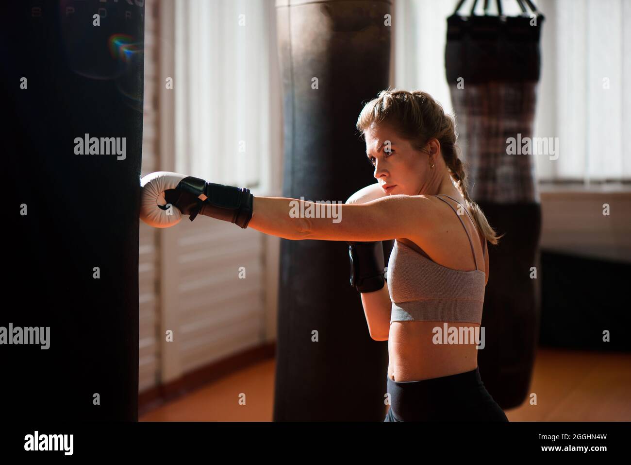 A female boxer train hard in a boxing studio Stock Photo - Alamy