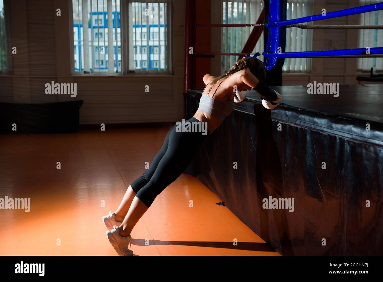 Woman on boxing training doing push ups Stock Photo - Alamy