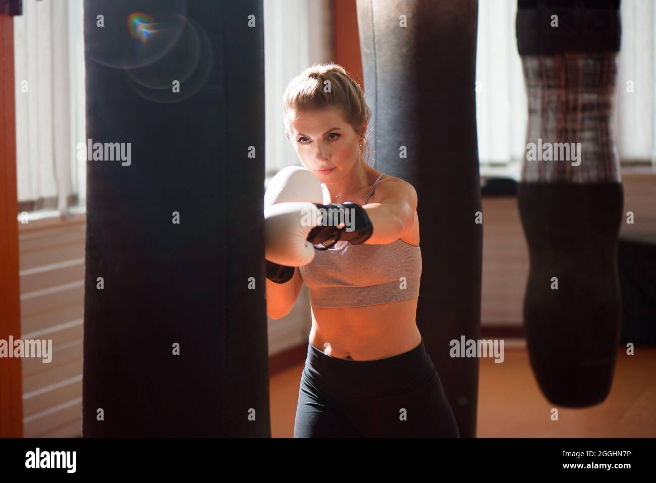 A female boxer train hard in a boxing studio Stock Photo - Alamy