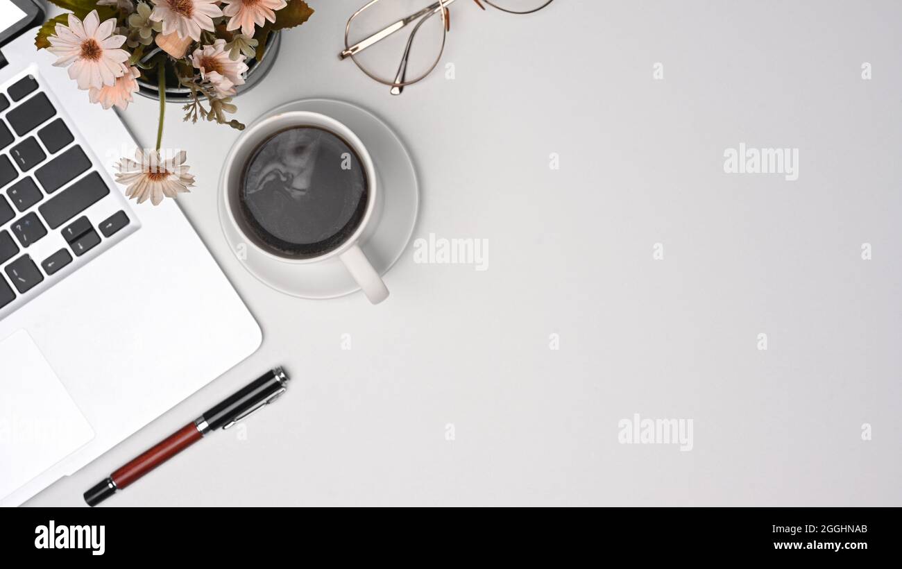 Simple workspace with laptop computer, coffee cup and glasses Stock ...