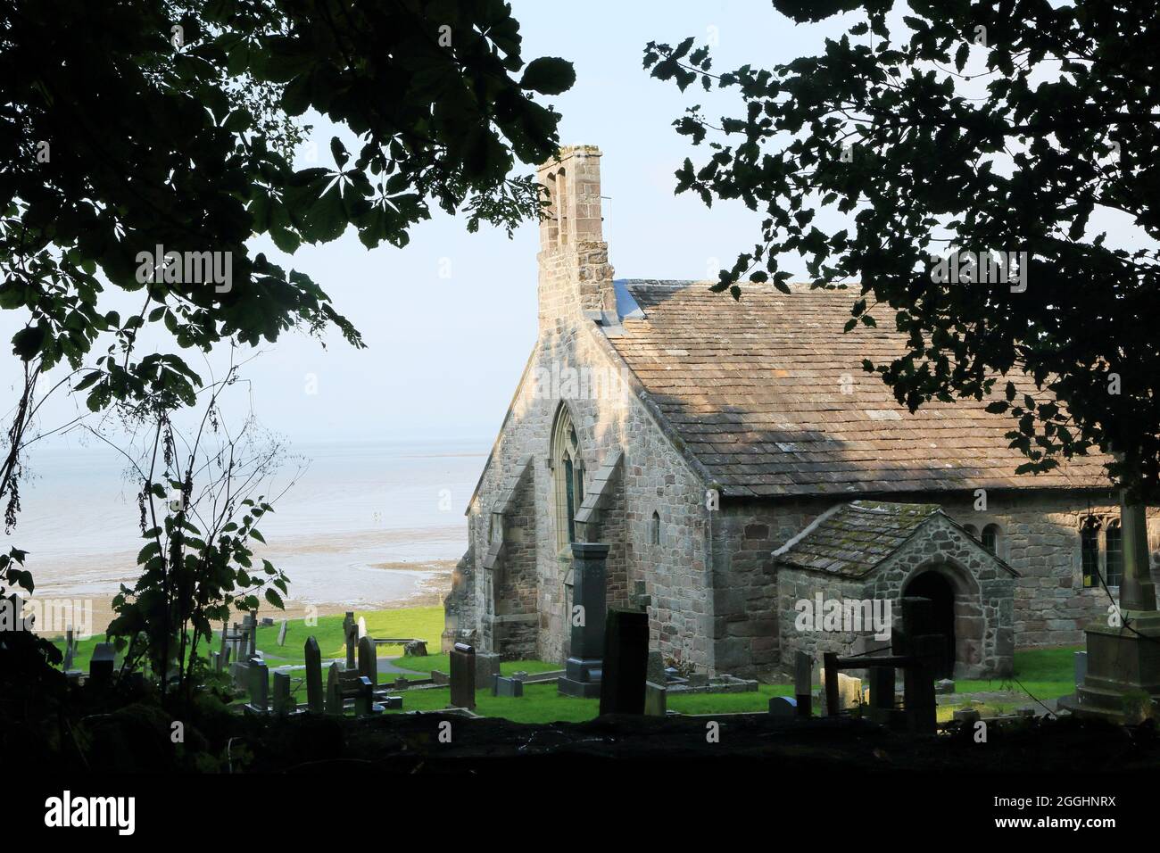 View of Morecambe Bay behind St Peter's Church off Main Street, Heysham ...