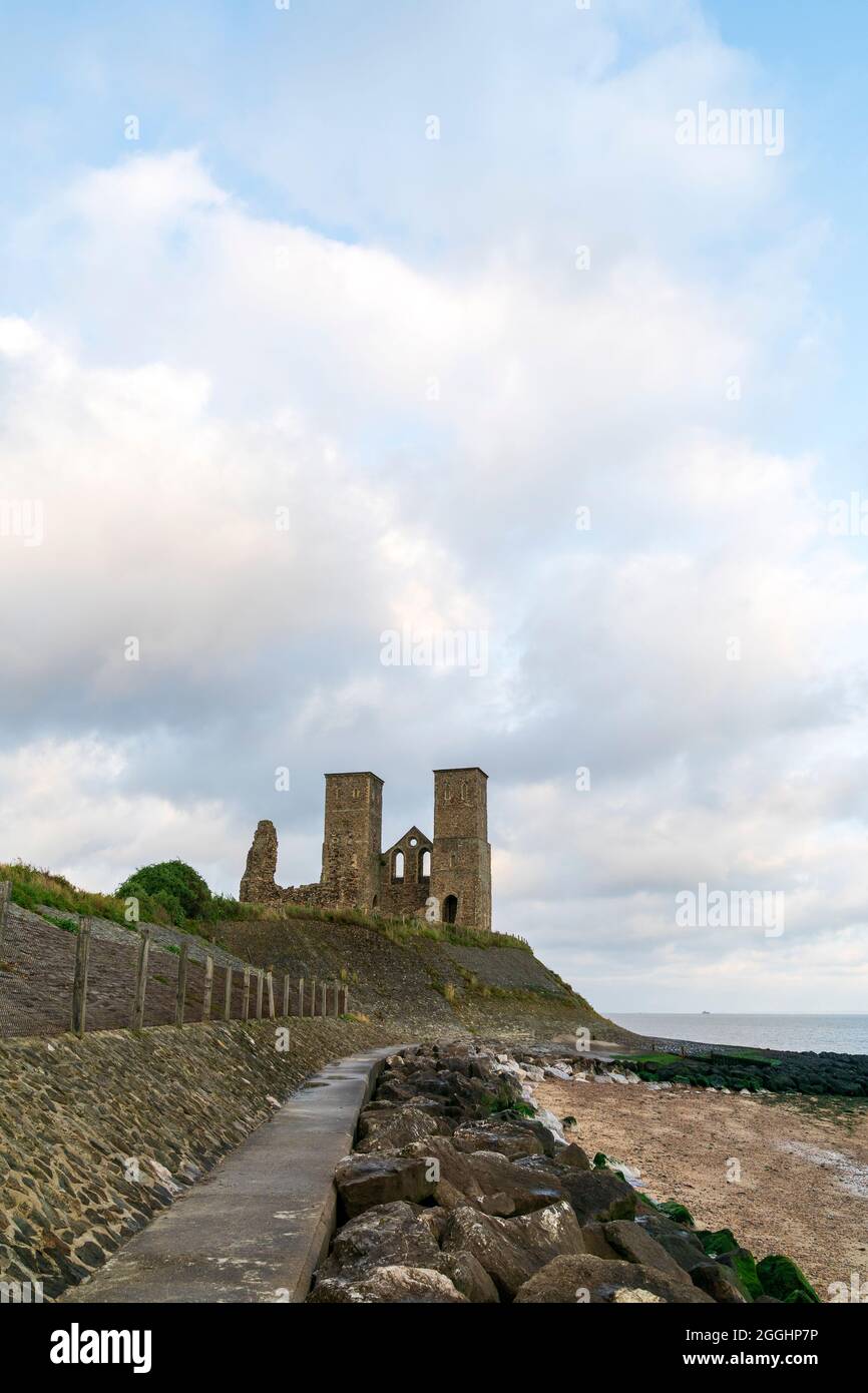 The beach, seawall and 12th century twin towers of the ruins of the ...