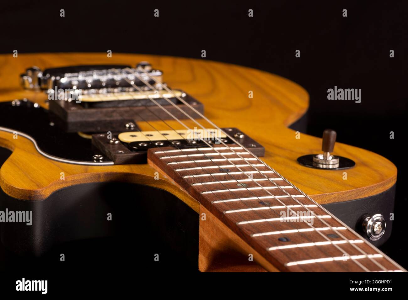 front part of the body of an electric guitar on black background Stock ...