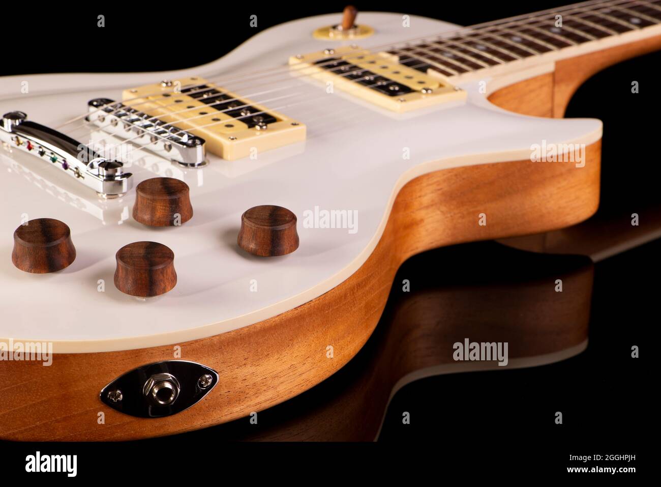 front part of the body of an electric guitar on black background Stock ...