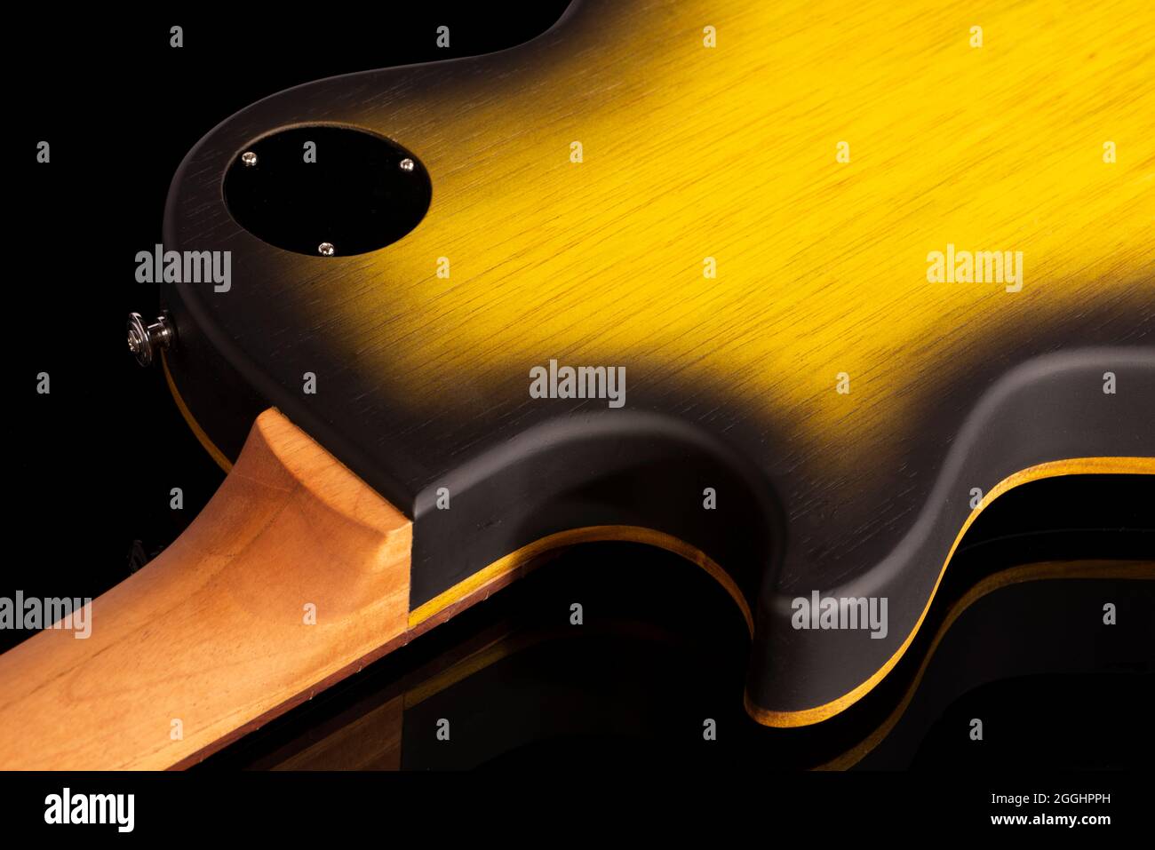 back part of the body of an electric guitar on black background Stock ...