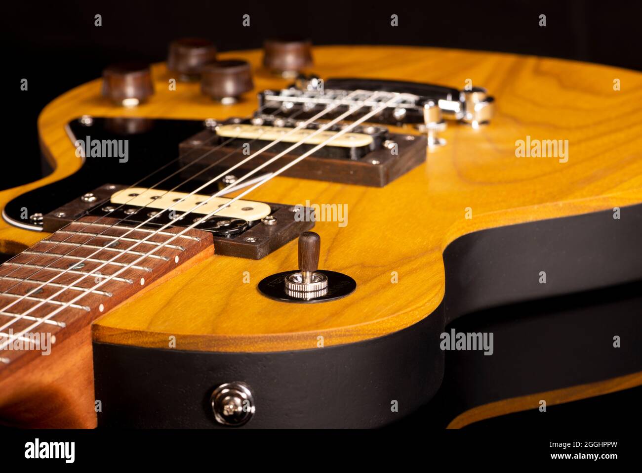 front part of the body of an electric guitar on black background Stock ...
