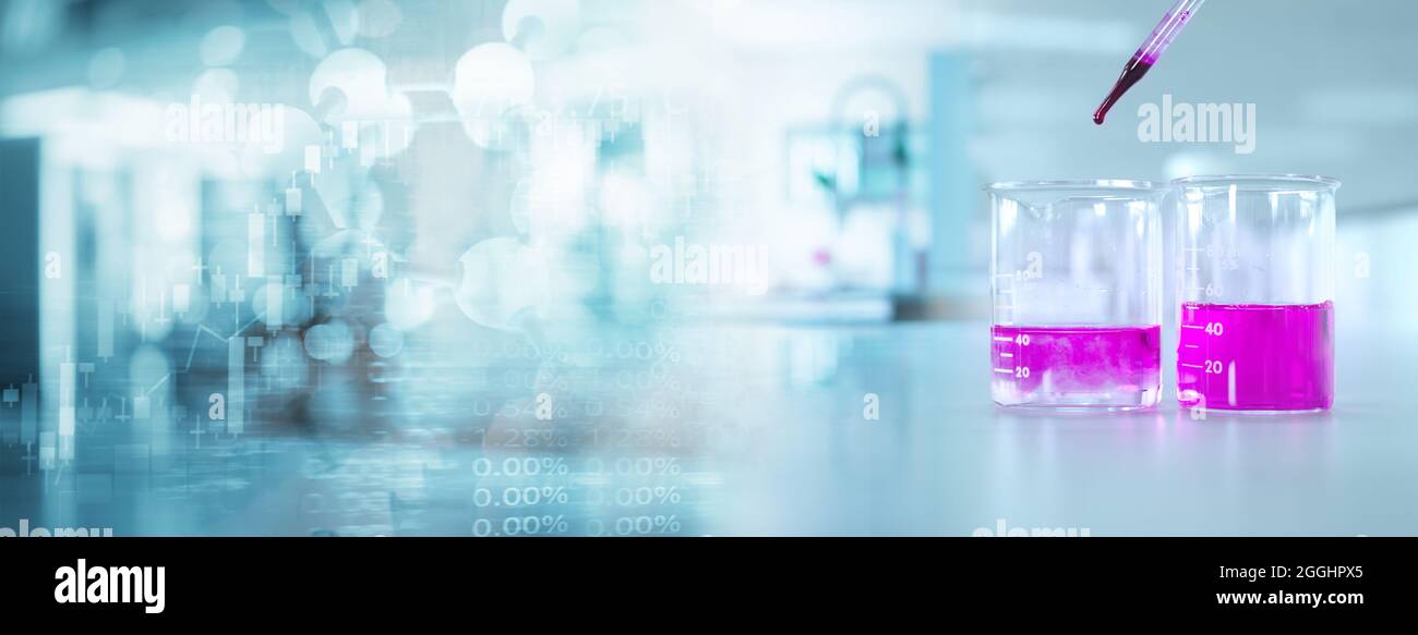 two glass beaker with pink solution with soft information and chemistry ...