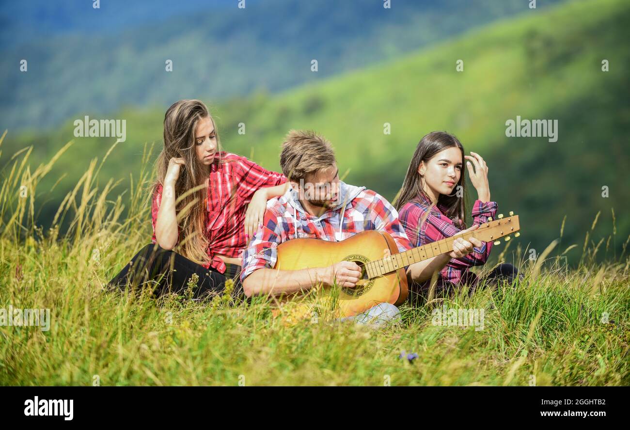 Melody of nature. Hiking tradition. Friends hiking with music. Singing ...