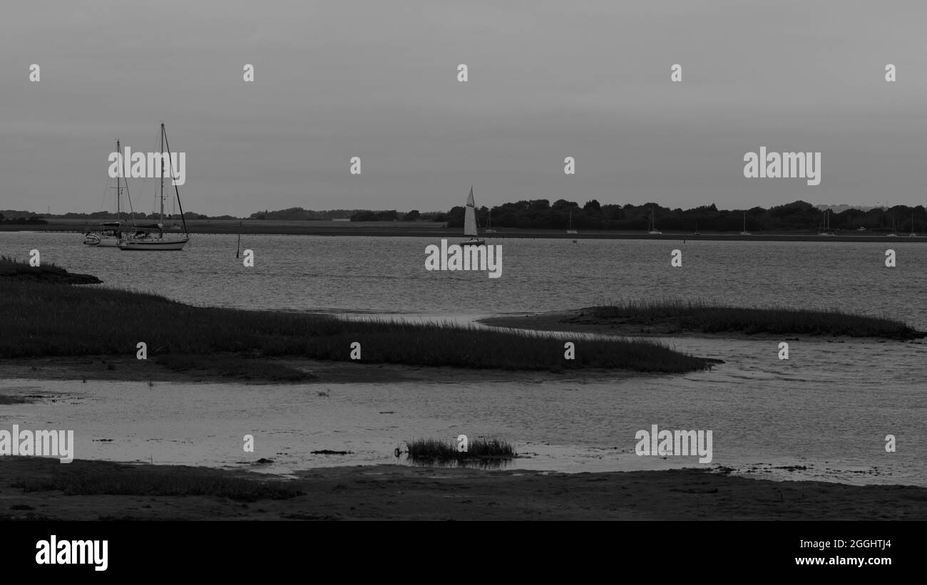 Boats in estuary Stock Photo - Alamy