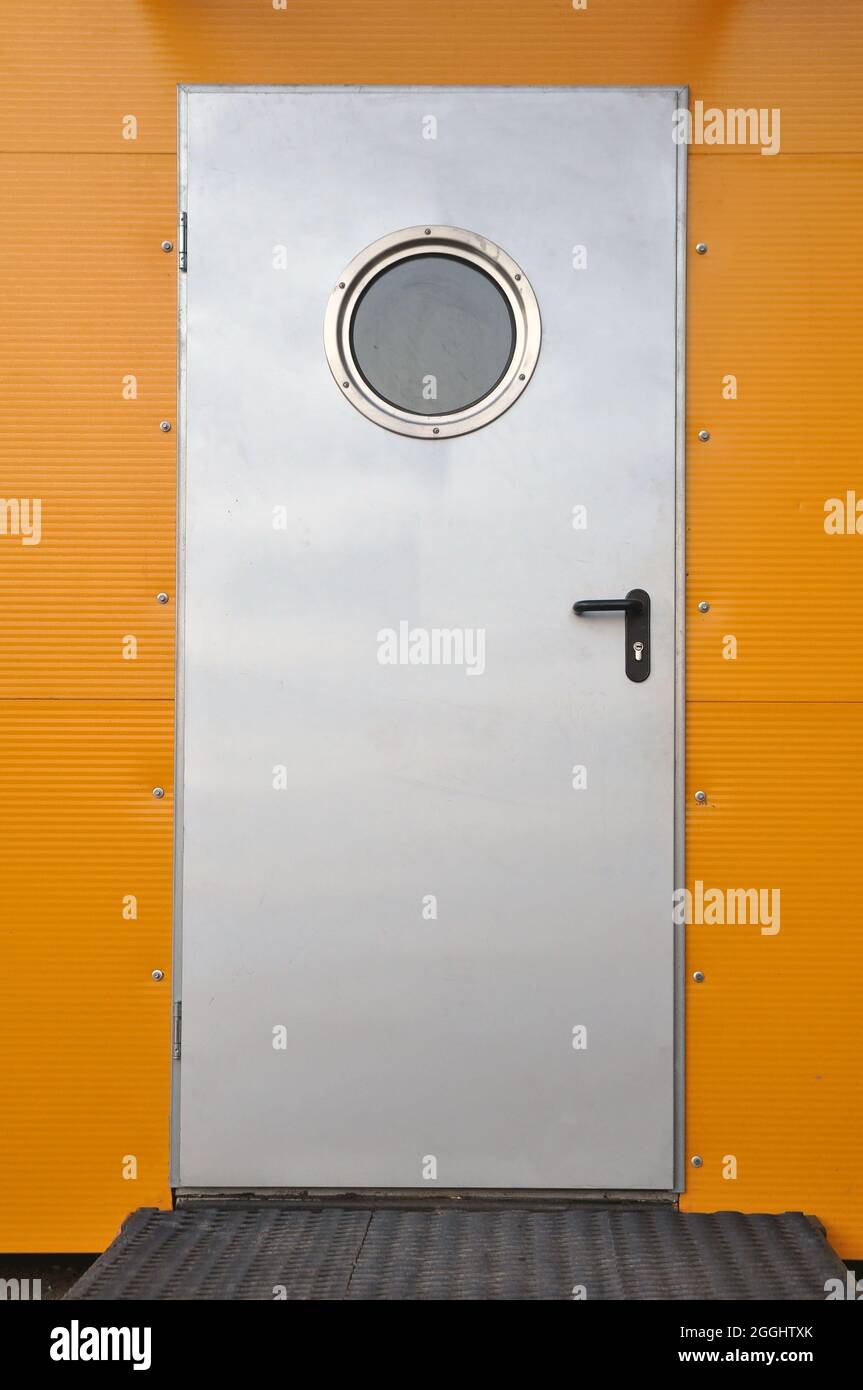 Fireproof door with a round window. Access to the utility room Stock ...