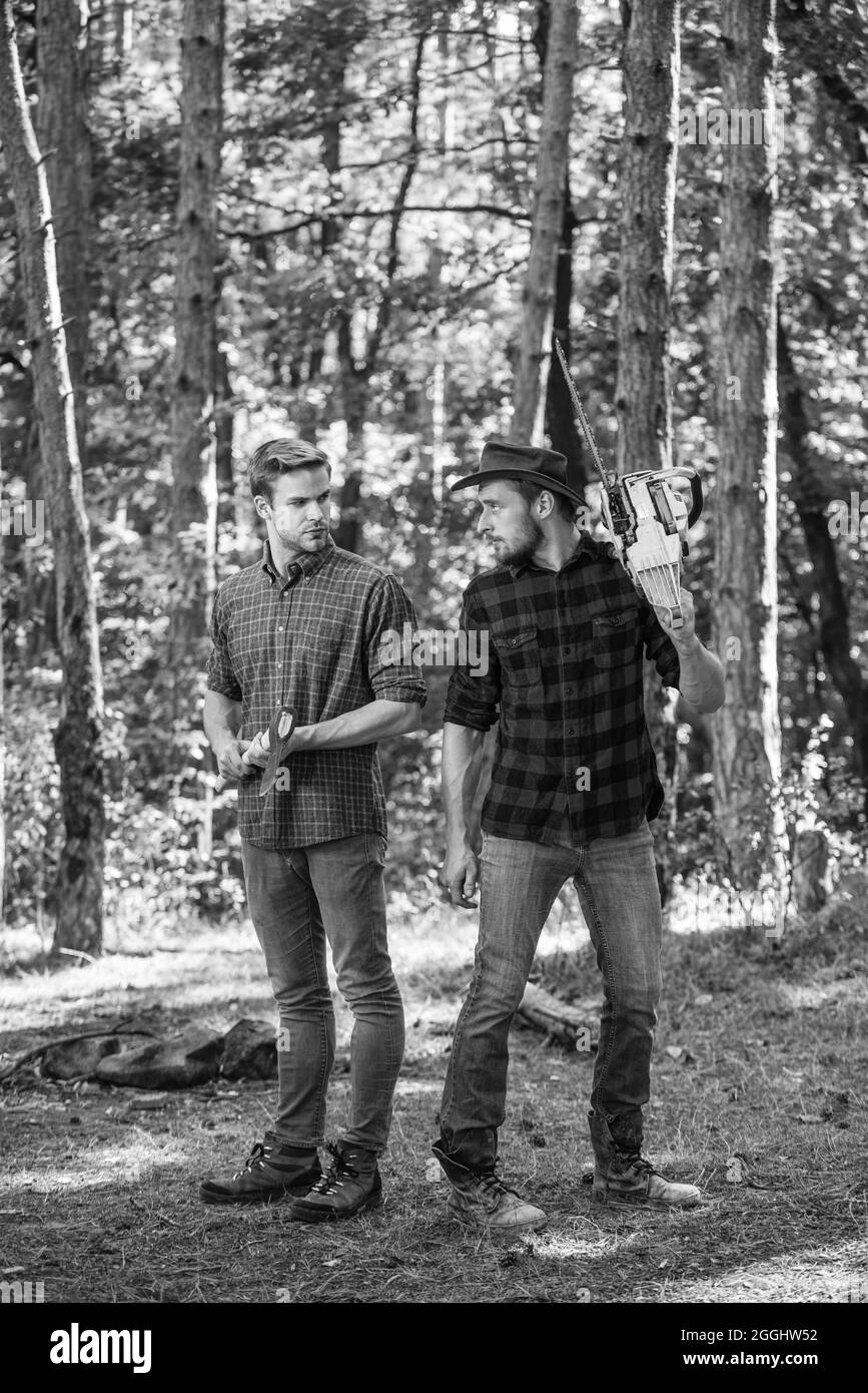 rangers use lumberjack equipment. Lumberjack with chainsaw and ax ...