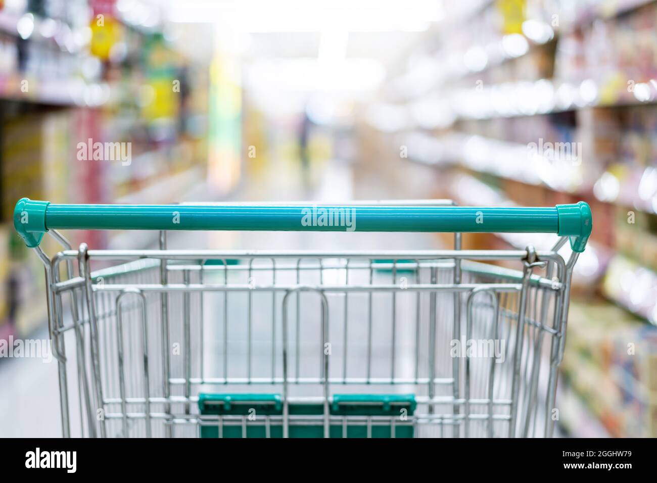 shopping cart in supermarket aisle with product shelves interior Stock ...
