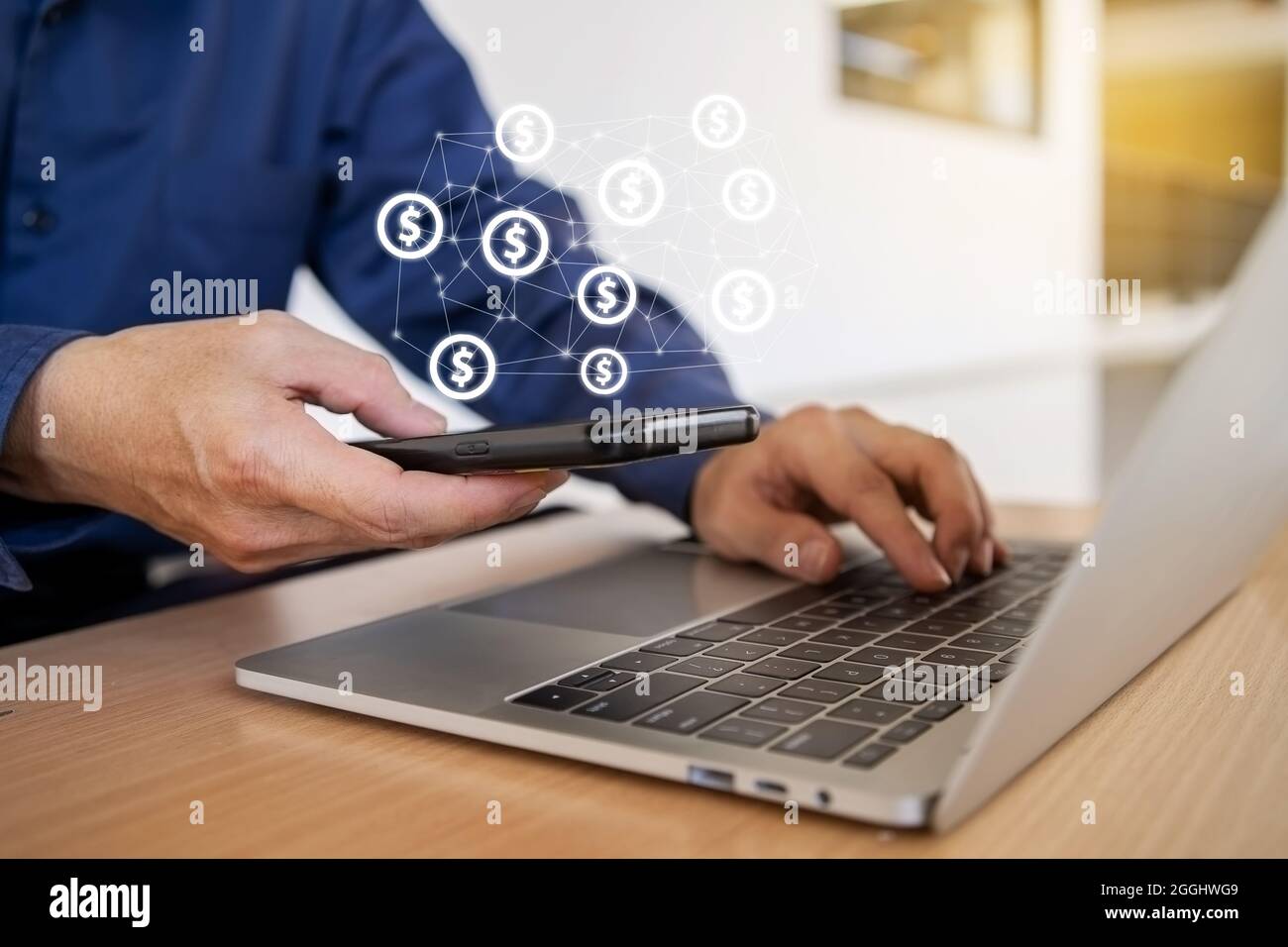 Hand using mobile phone with online transaction application while ...