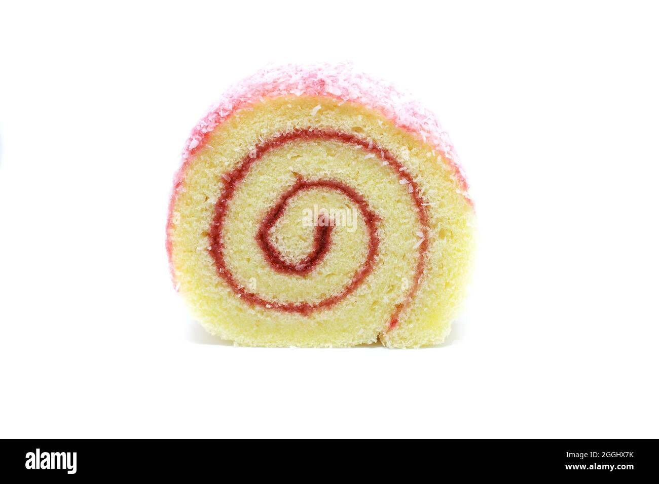 fresh sweet roll cake with raspberry jam and coconut flakes, isolated ...