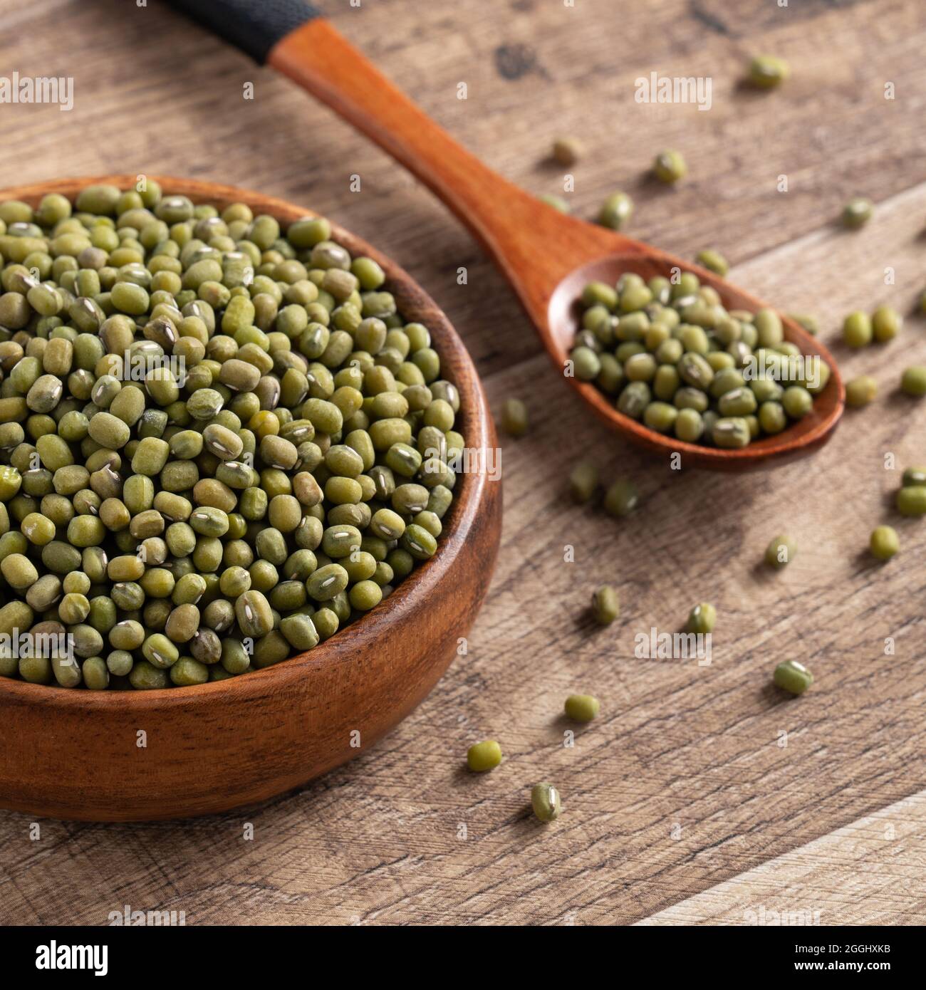 Close up of raw mung bean in a bowl on wooden table background Stock ...
