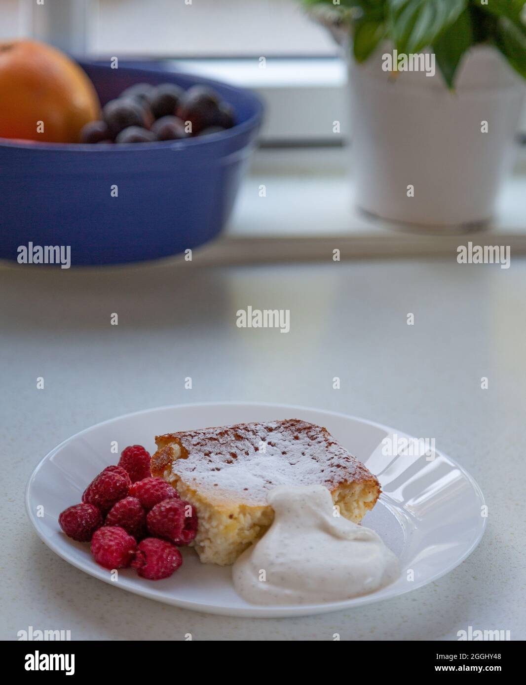 Closeup. Swedish cheese cake with fresh raspberry and whipped cream on ...
