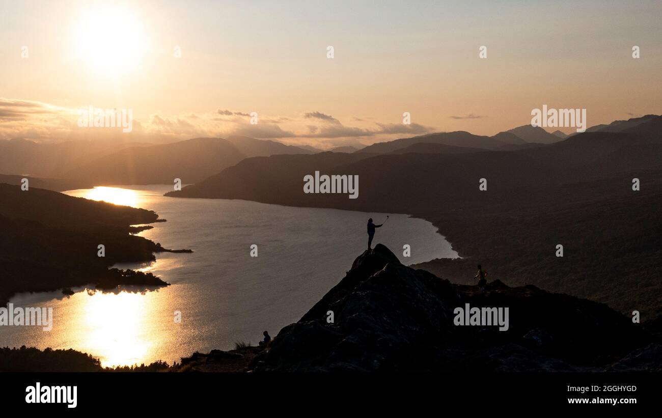 Ben An’a summit, Scotland, 26 August 2021. Pictured: A silhouetted ...