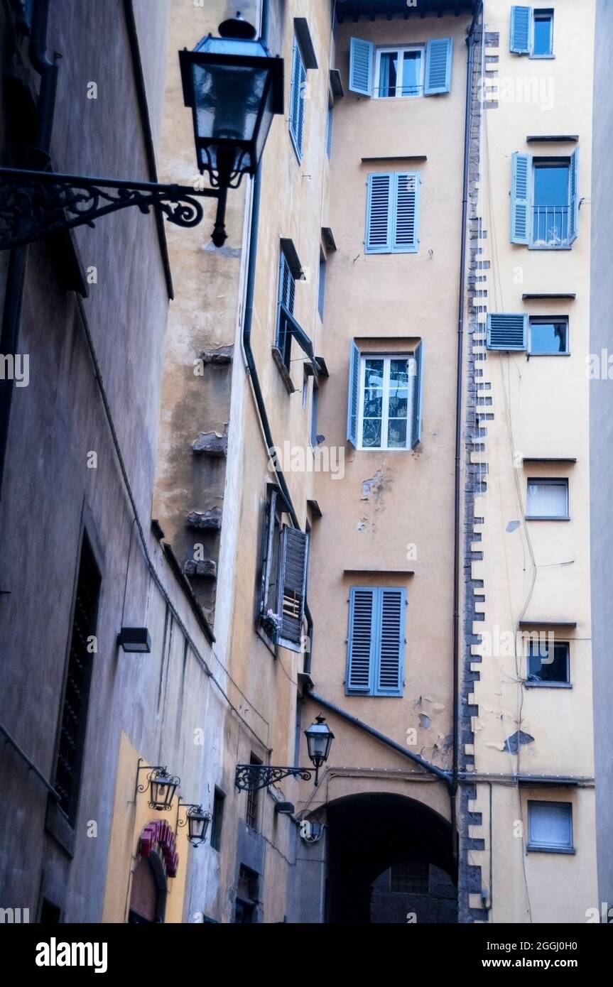 Painted shutters, medieval residential buildings and narrow arched ...