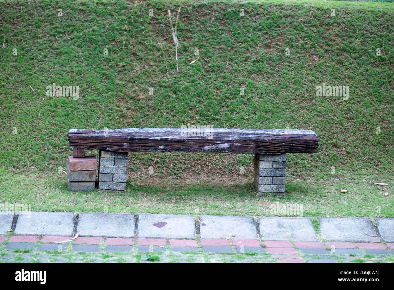 wooden chair in a park with green grass background Stock Photo - Alamy