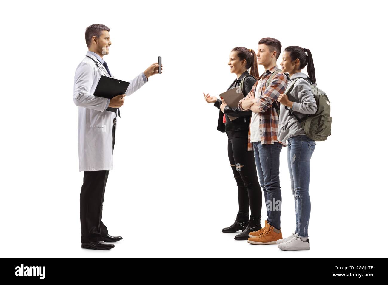 Male doctor showing a mobile phone to a group of students isolated on ...