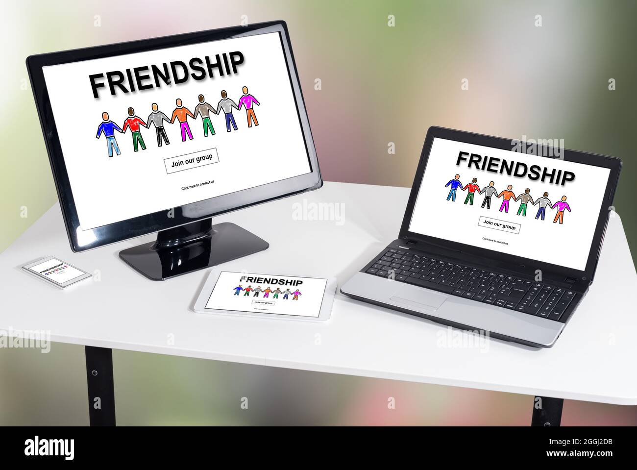 Friendship concept shown on different information technology devices ...