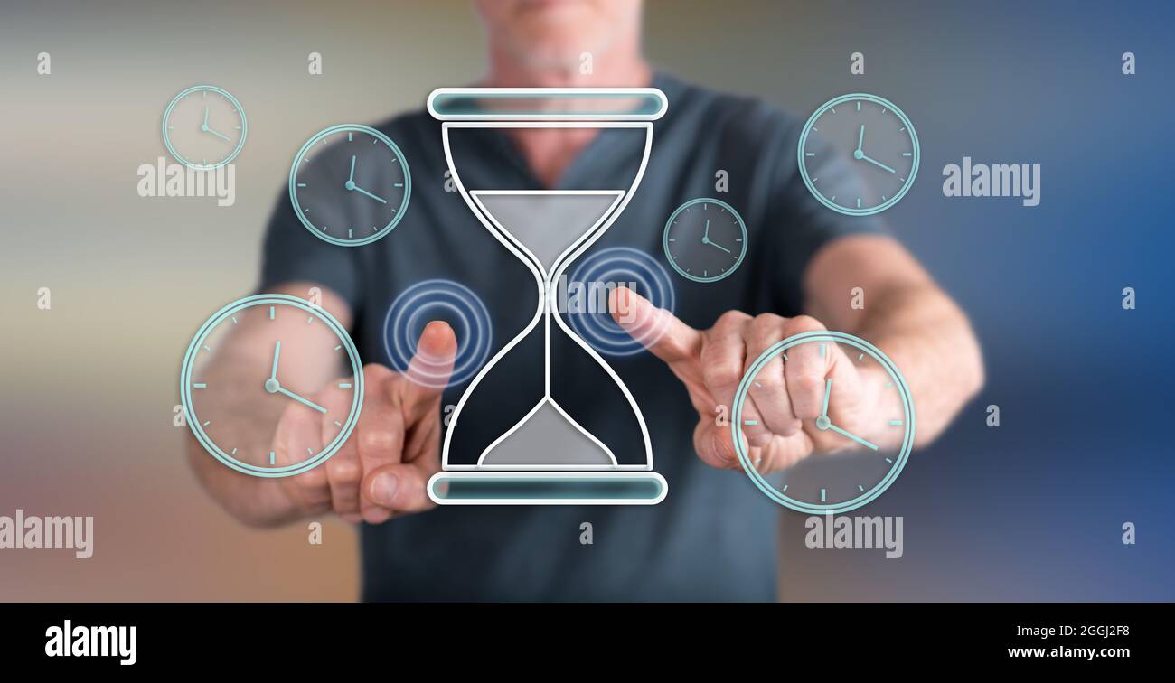 Man touching a time management concept on a touch screen with his ...