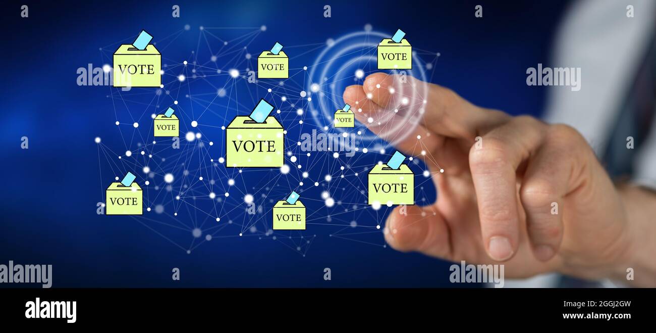 Man touching an online voting concept on a touch screen with his finger ...