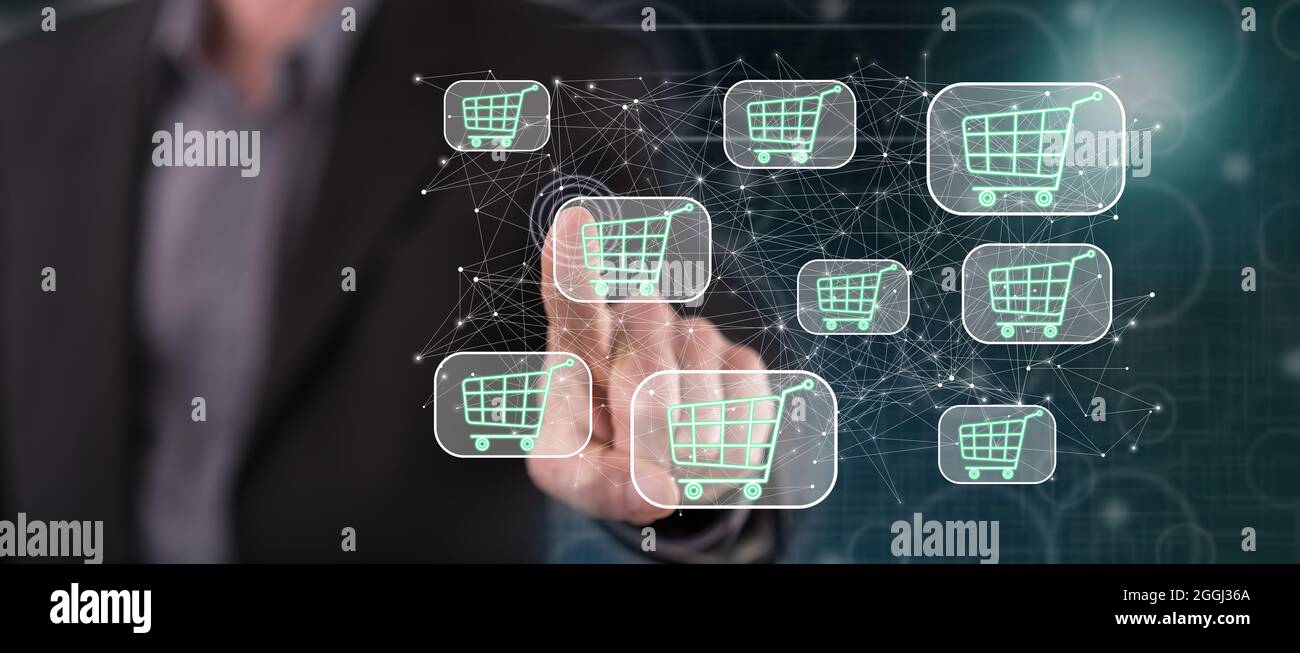 Man touching an online shopping concept on a touch screen with his ...
