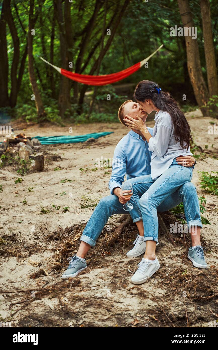 Romantic couple embracing during picnic in forest Stock Photo - Alamy