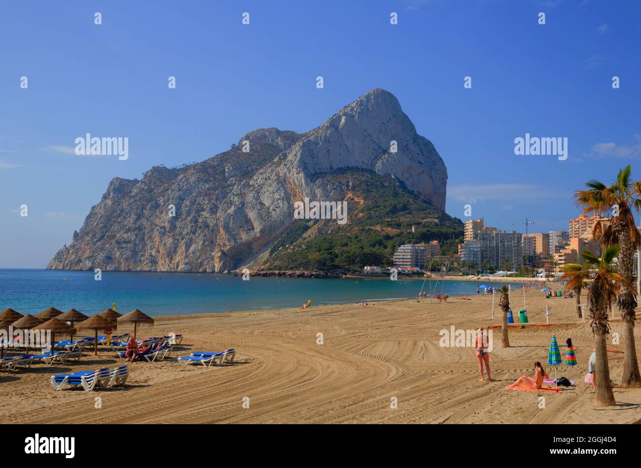 Calp Spain rock from Levante La Fossa sandy beach Costa Blanca scene ...