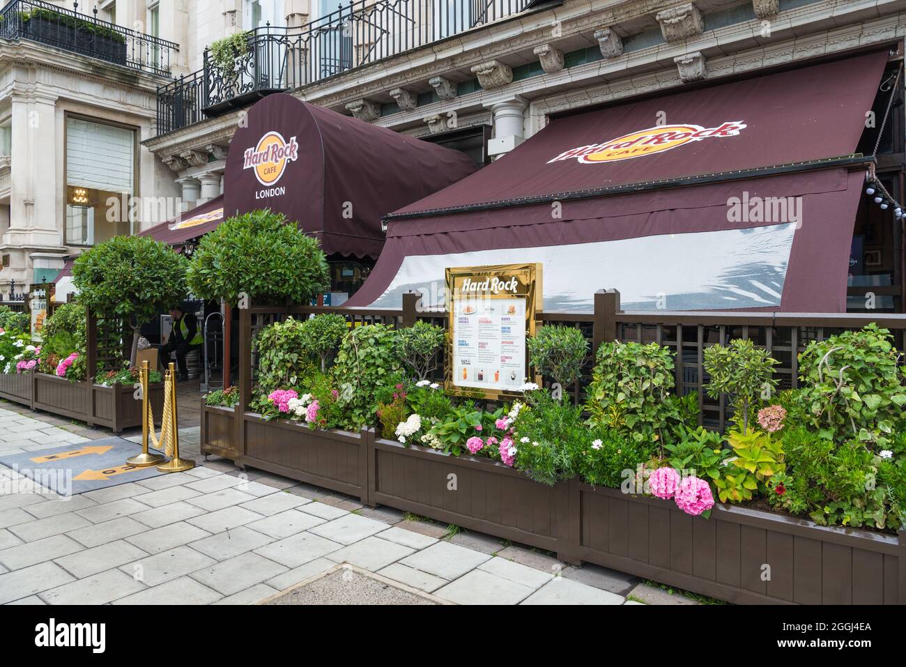 Exterior of the Hard Rock Cafe with street dining terrace sceened by ...