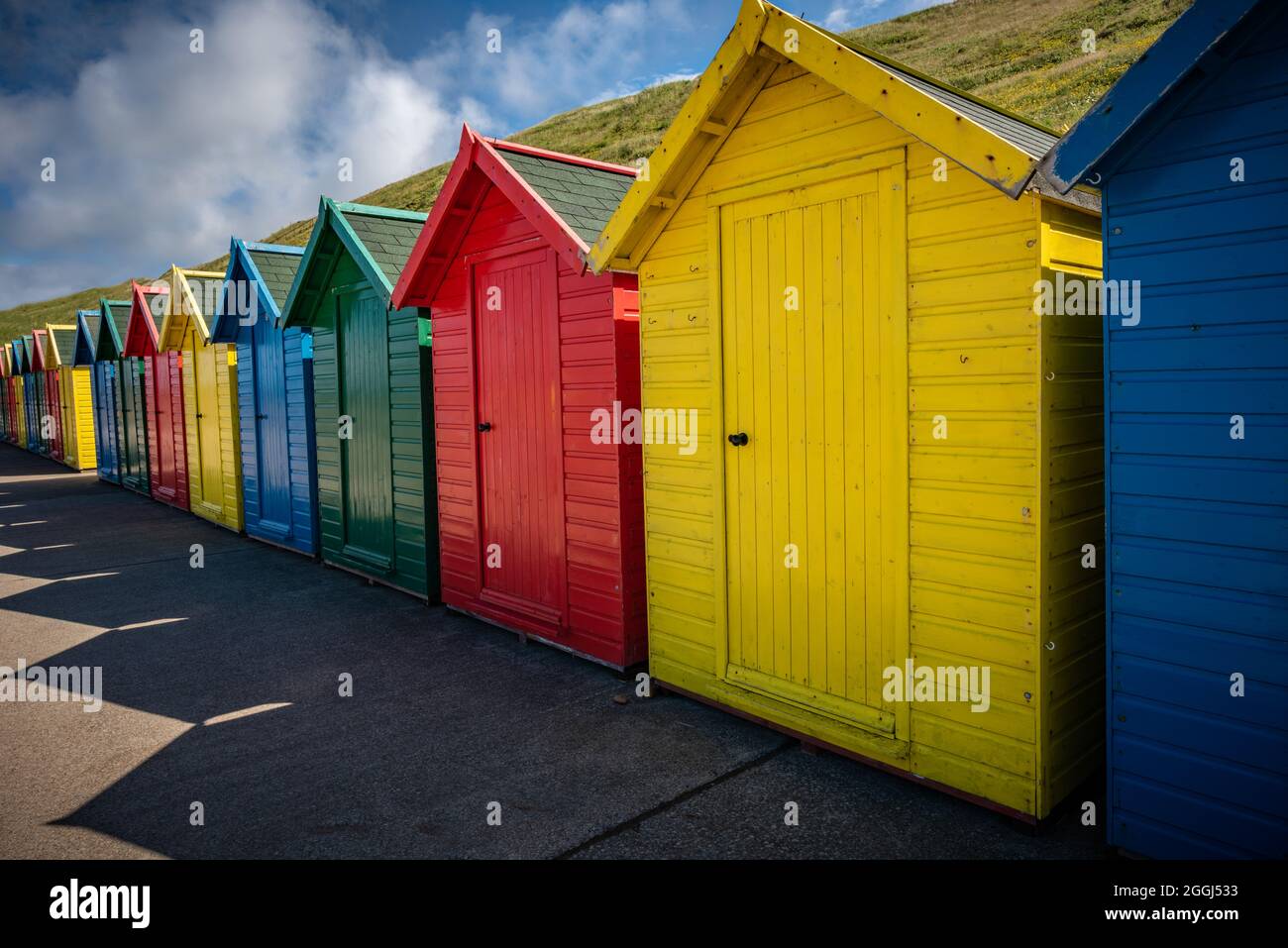 photography of beach changing rooms of different colors Stock Photo - Alamy