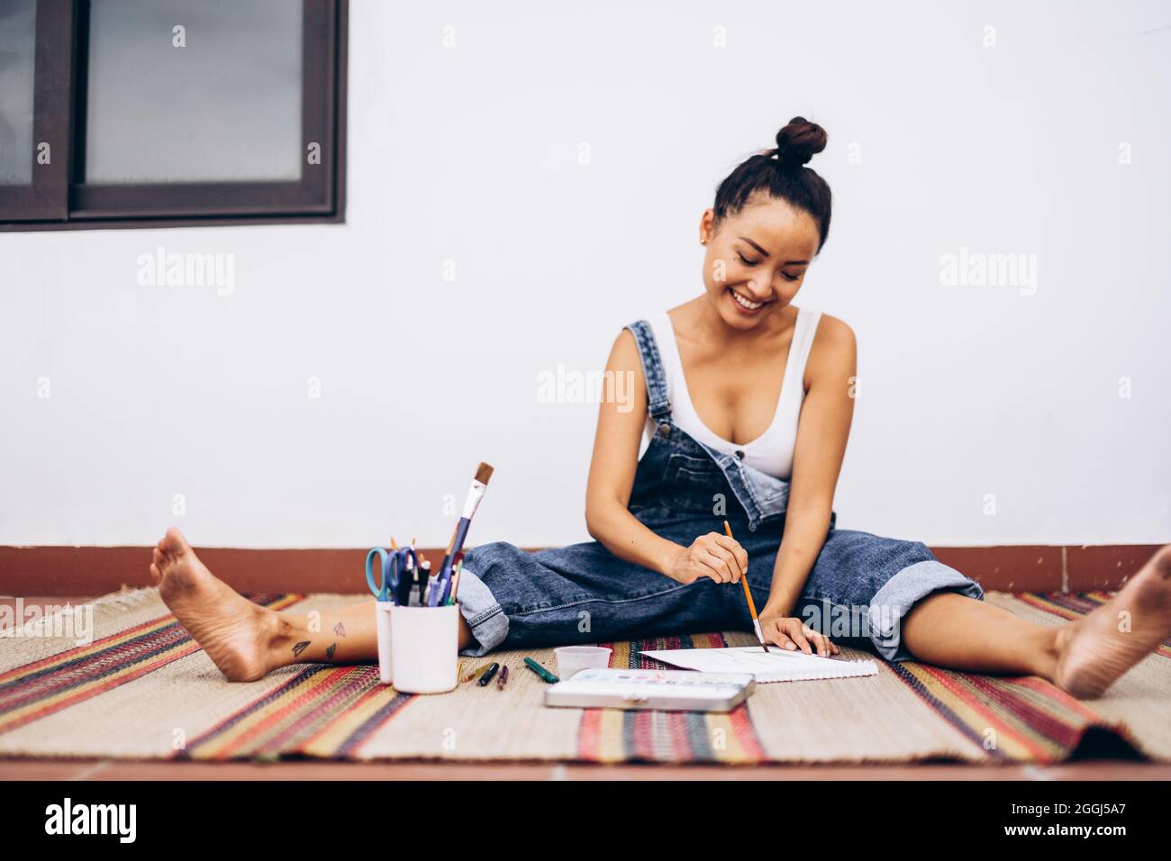 Dreamy Artist painting the picture with watercolors Stock Photo - Alamy