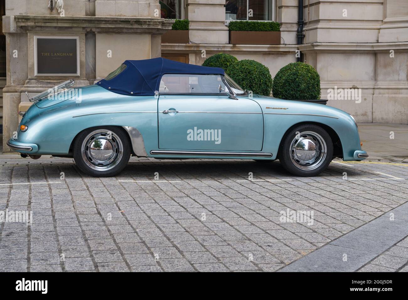 Light blue convertible Porsche Speedster (possibly a 356?) sports car ...
