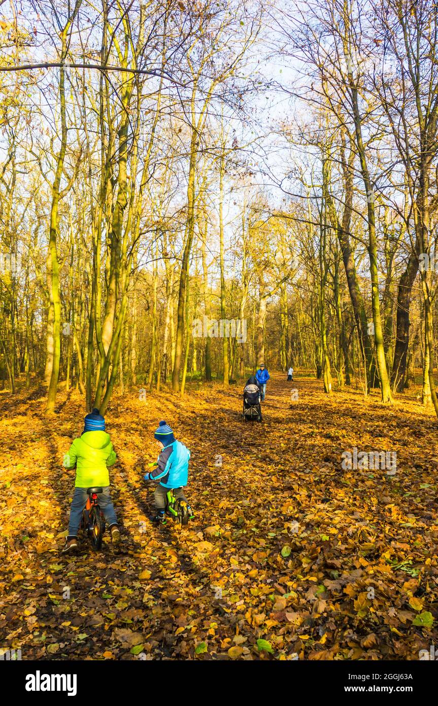 POZNA, POLAND - Nov 17, 2018: The Young boy riding a bicycle in the ...