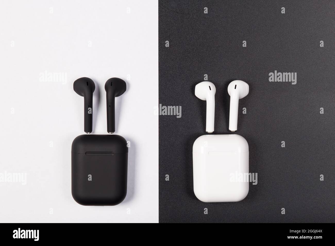 Black wireless eardots and white wireless eardots with charging cases ...