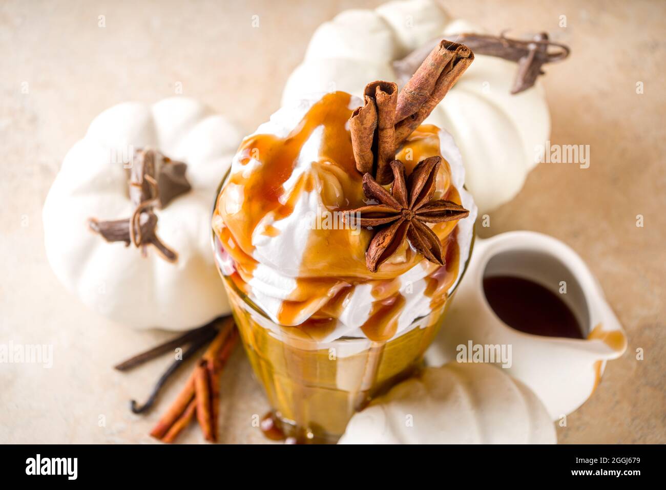 Pumpkin spice latte or milkshake,traditional autumn hot drink with ...
