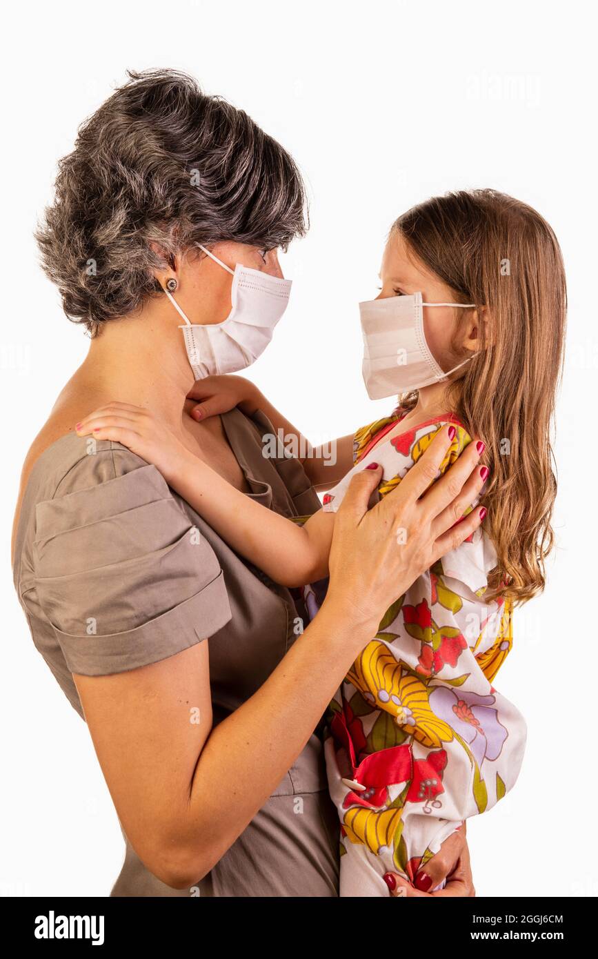 Mother daughter wearing face mask masks hi-res stock photography and ...