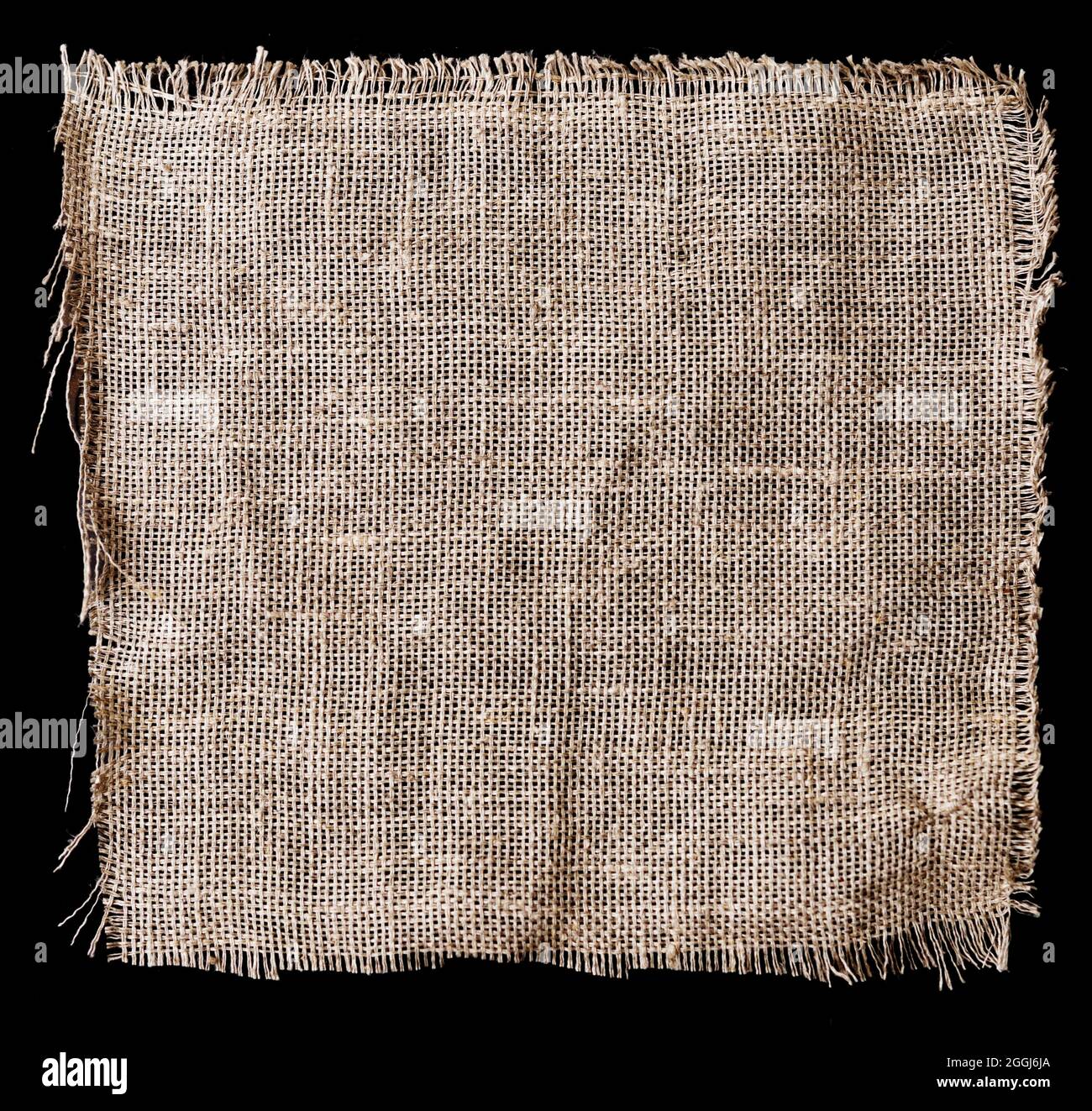 Sackcloth piece on black background Stock Photo - Alamy