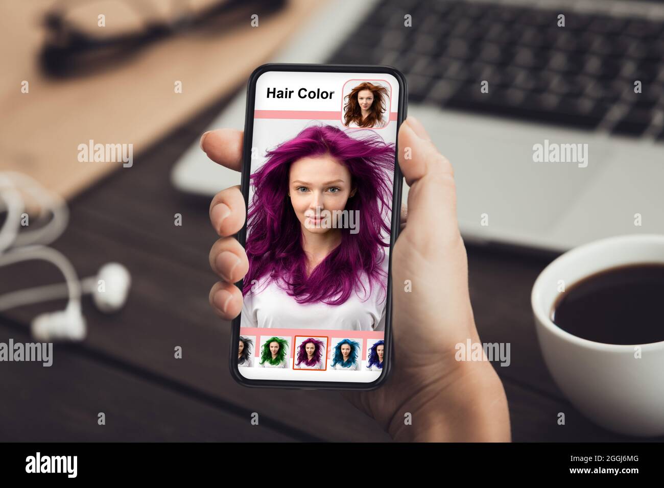 Young lady trying new hairstyle via hair simulation mobile application ...