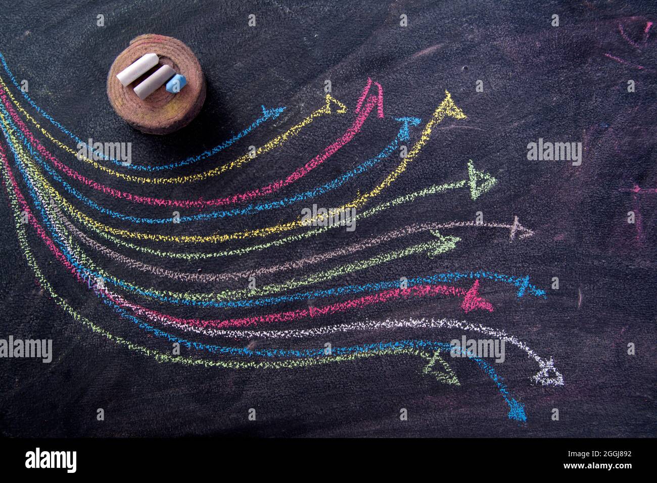 Curved colored arrows drawn with chalk on blackboard Stock Photo - Alamy