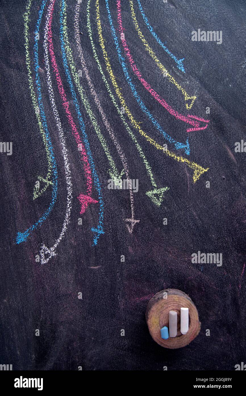 Curved colored arrows drawn with chalk on blackboard Stock Photo - Alamy